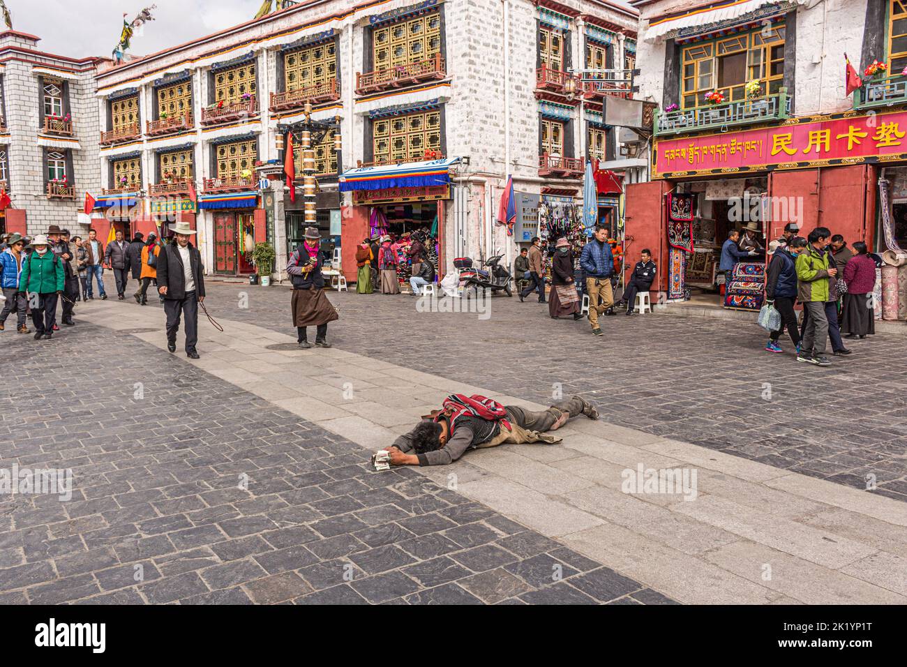 Tibetan buddhist pilgrims undertake the Kora clockwise circumambulation ...