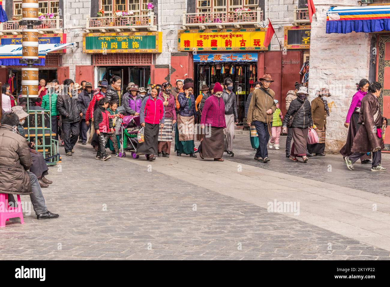 Tibetan buddhist pilgrims undertake the Kora clockwise circumambulation ...