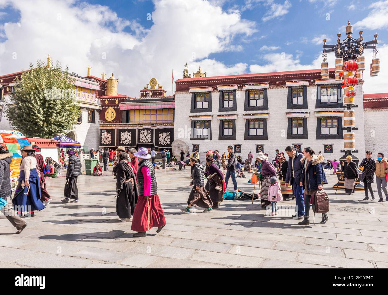 Tibetan buddhist pilgrims undertake the Kora clockwise circumambulation ...
