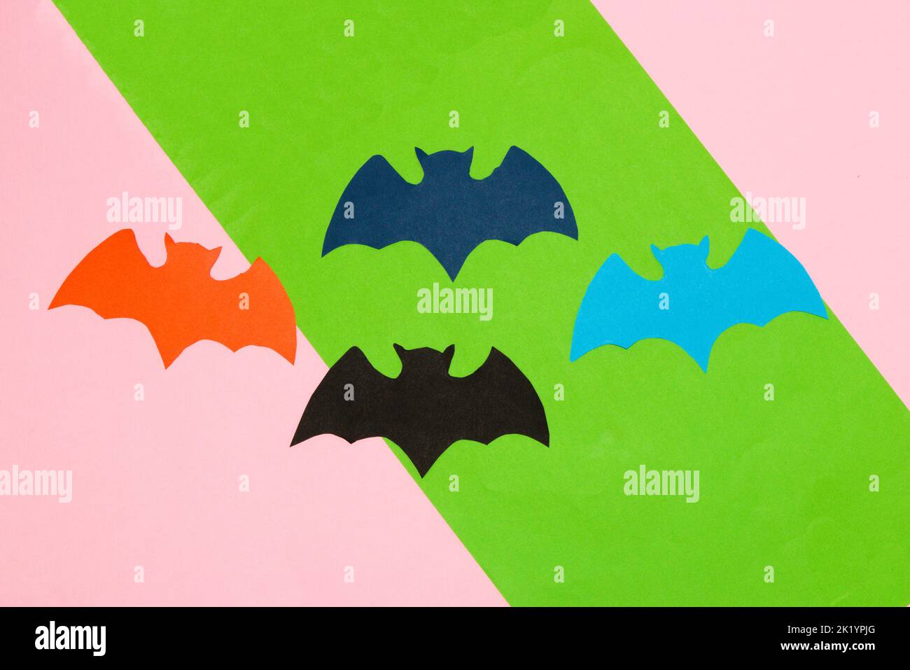 colorful bats on pink-green background, creative art design, halloween ...