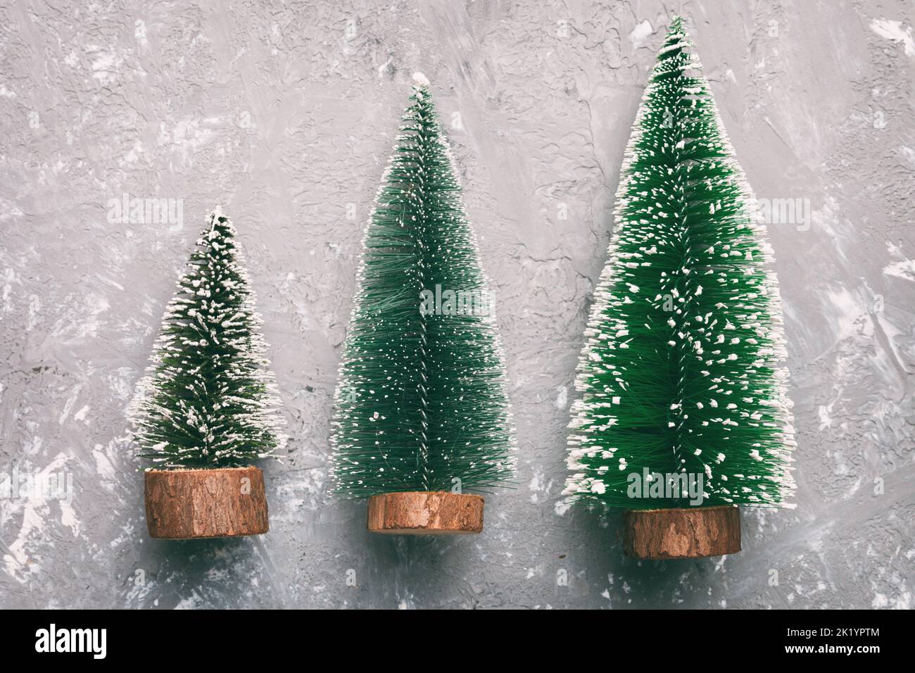 Flat lay composition with christmas trees on color background. Top view ...