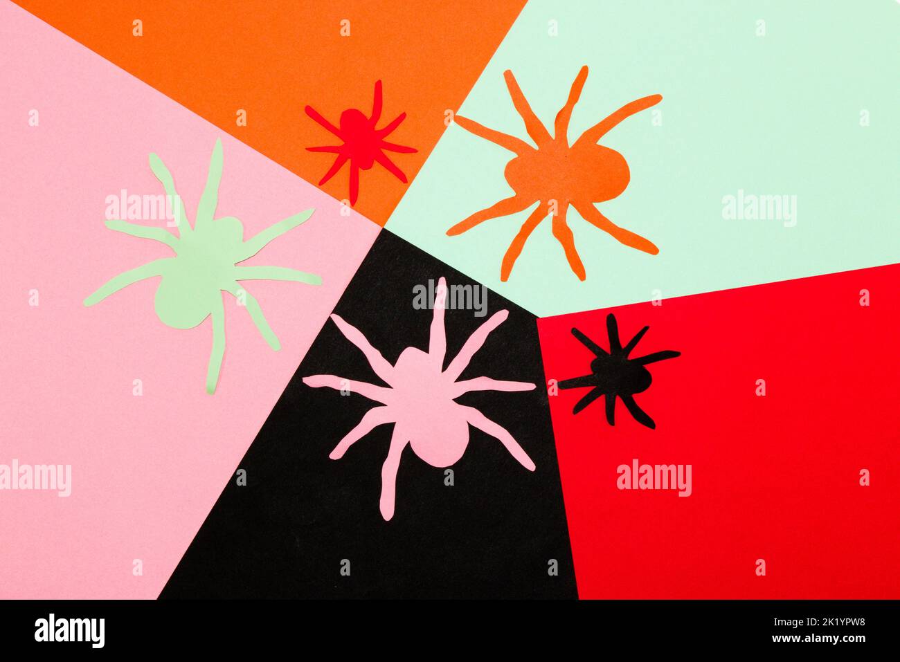 colorful background with colorful paper craft spiders, creative art ...