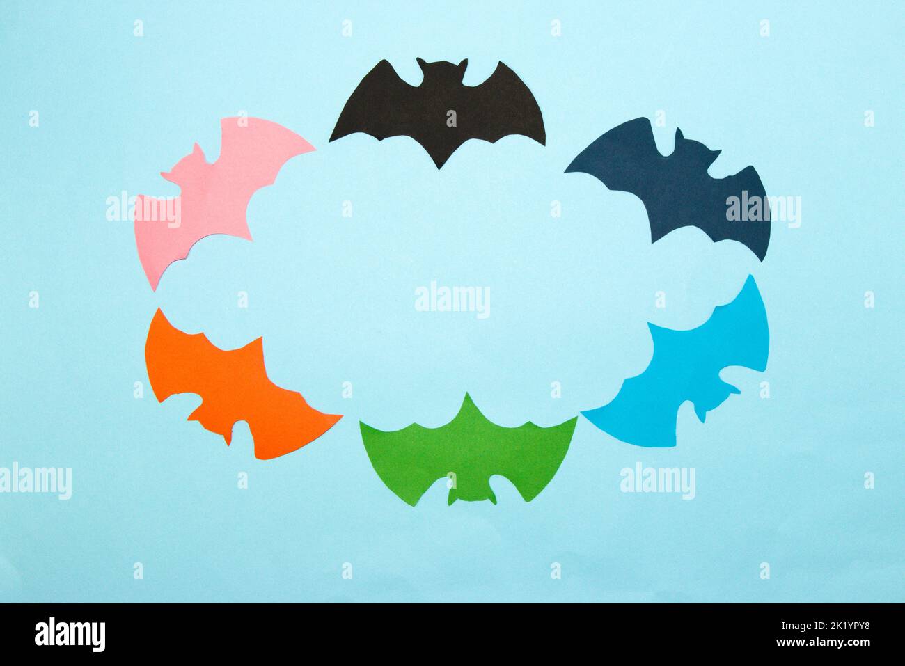 colorful bats on blue background form copy space, creative art ...