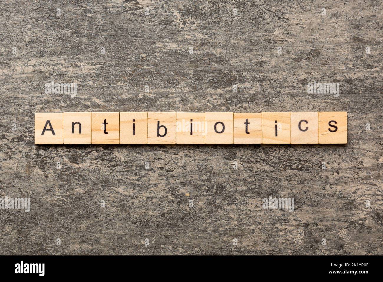 antibiotic word written on wood block. antibiotic text on table ...