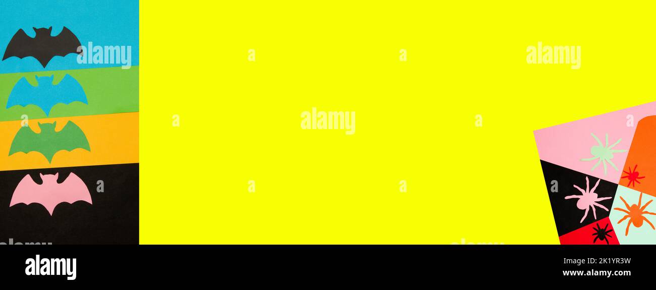 yellow banner with colorful bats on the left and colorful spiders on ...