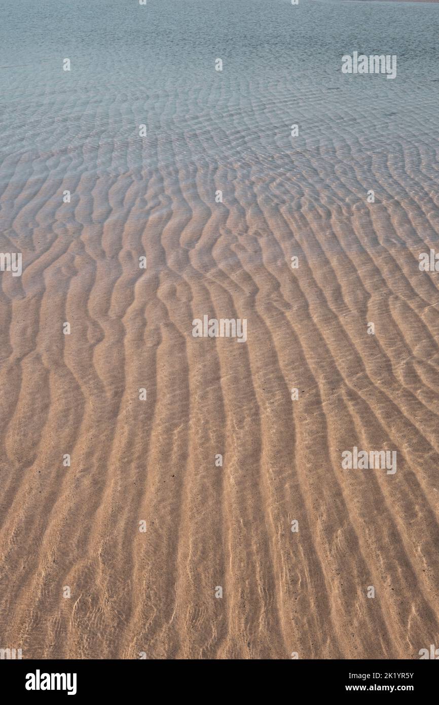 RIPPLES IN THE SAND PHOTOGRAPHED THROUGH THE SEA WATER Stock Photo - Alamy