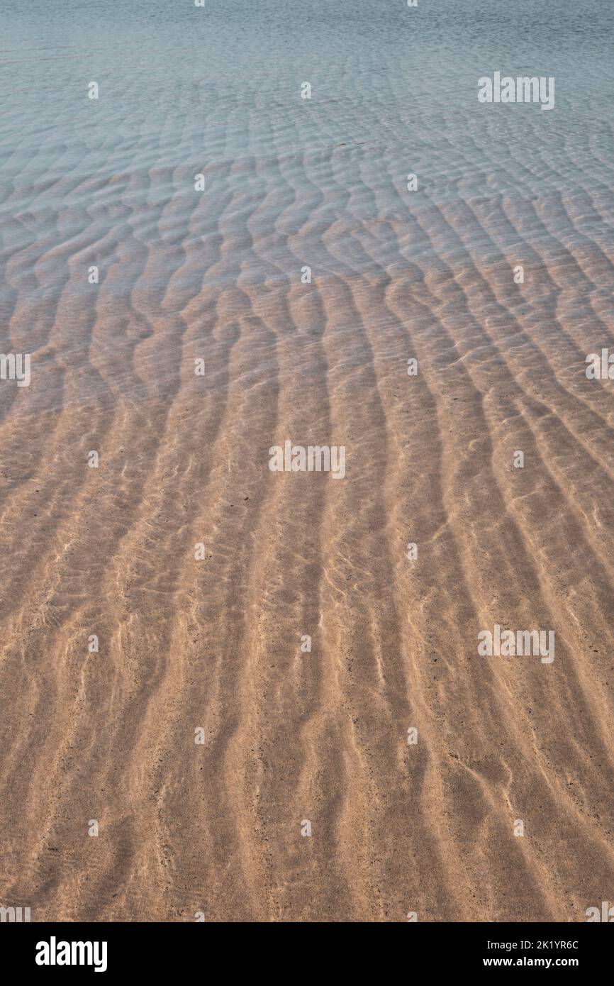RIPPLES IN THE SAND PHOTOGRAPHED THROUGH THE SEA WATER Stock Photo - Alamy