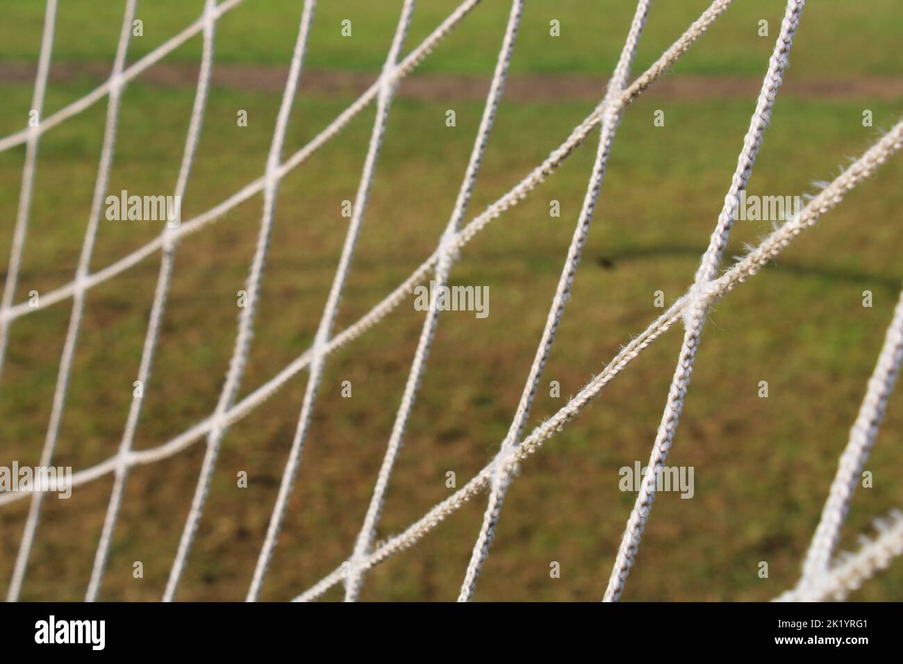 The grid from the old football goal close-up on the background of the ...