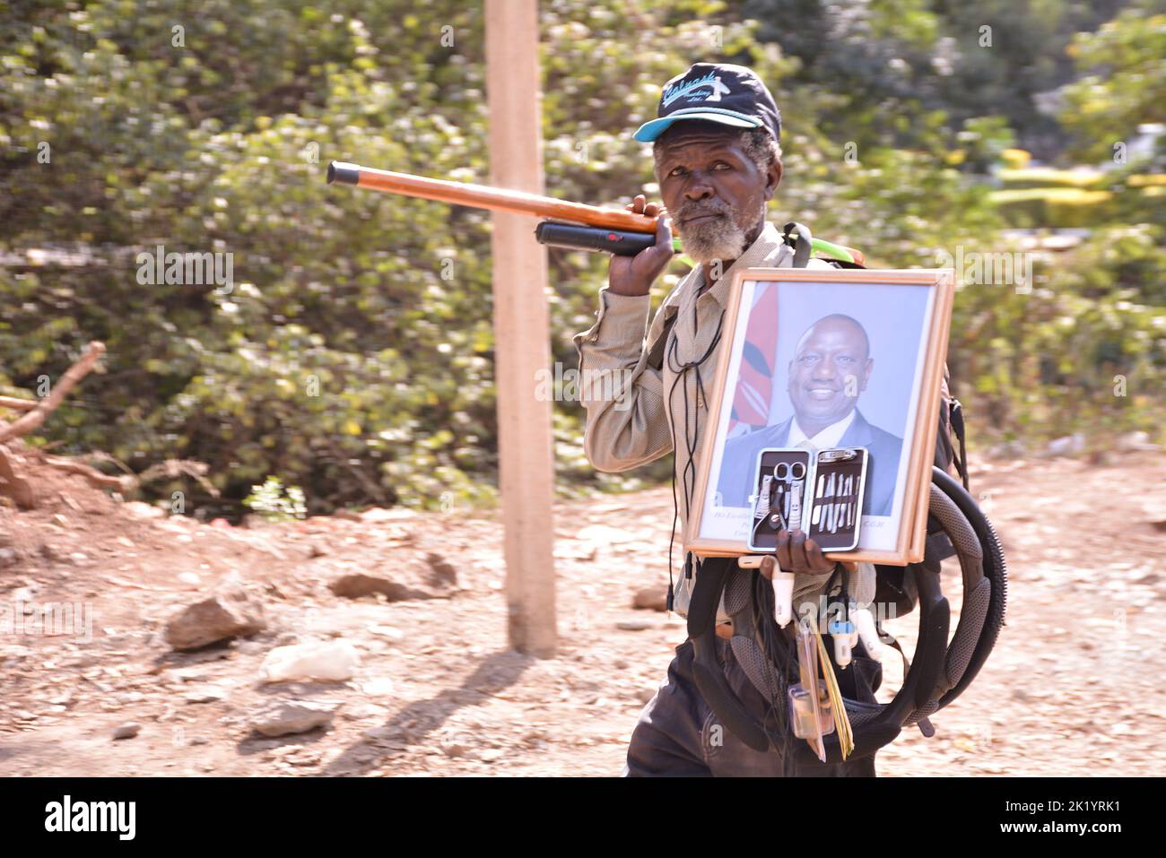 A street vendor is seen hawking his wares along the street in downtown ...
