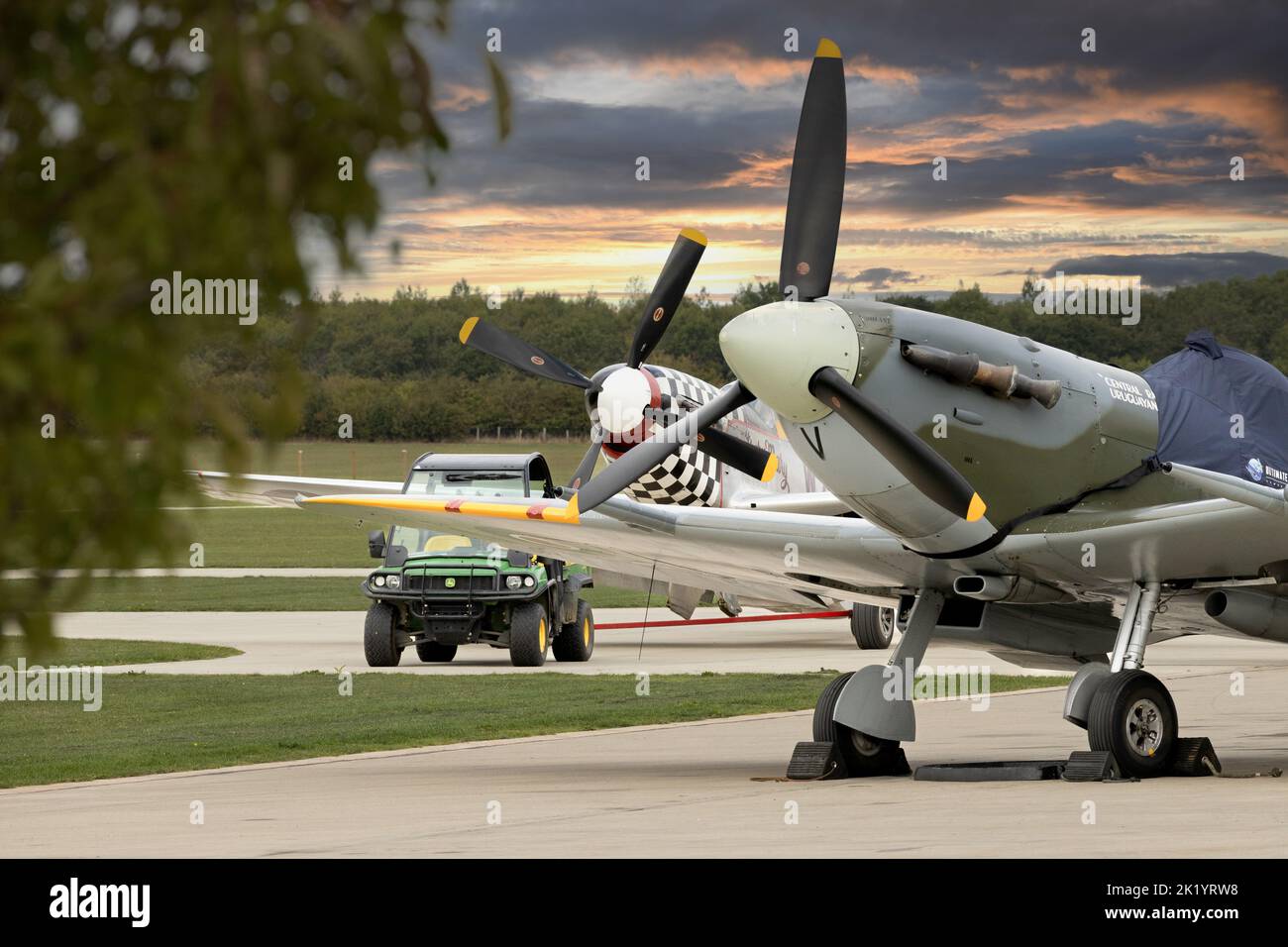 An sunset photograph of a Spitfire aeroplane at an aerodrome Stock ...