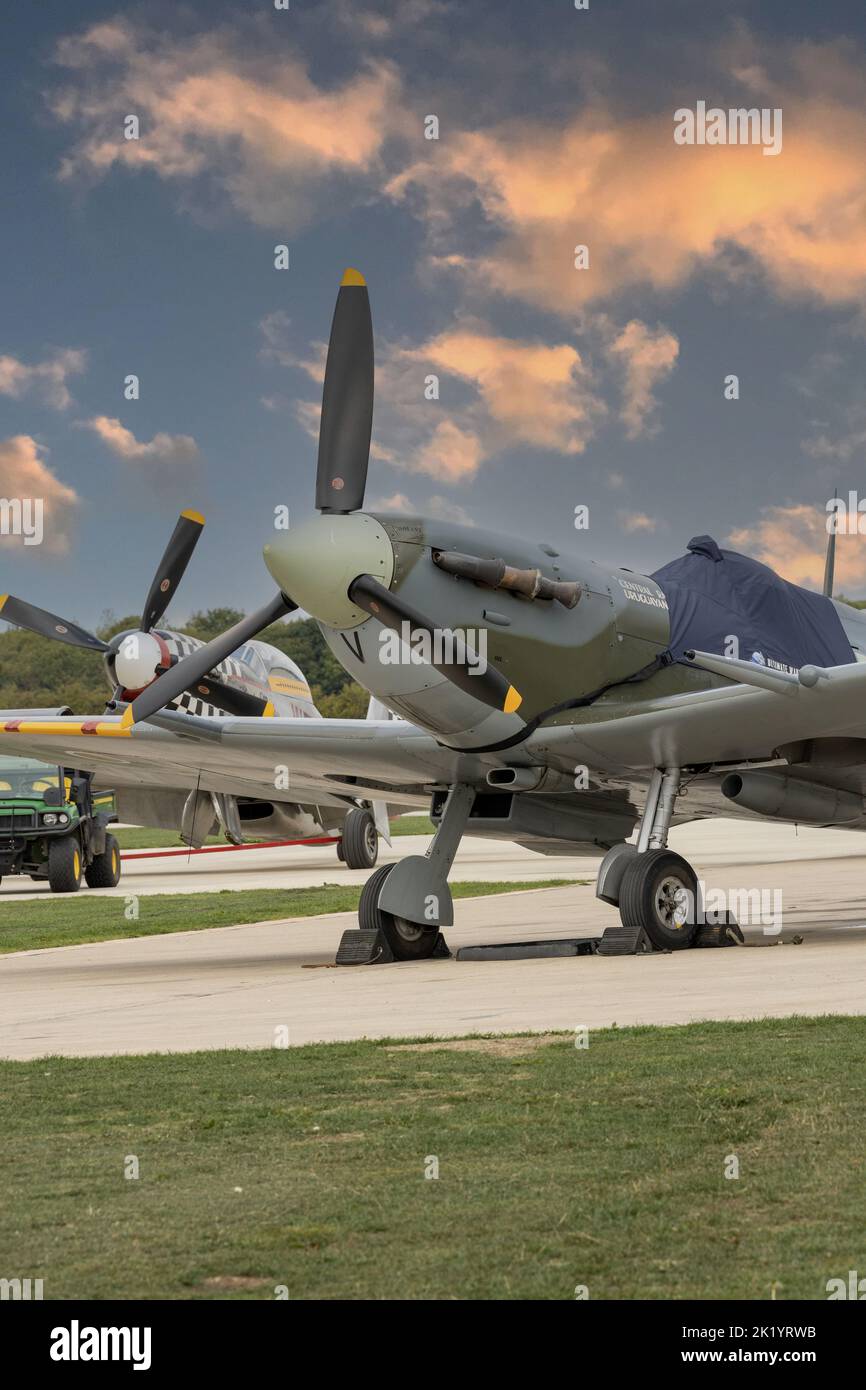 An sunset photograph of a Spitfire aeroplane at an aerodrome Stock ...
