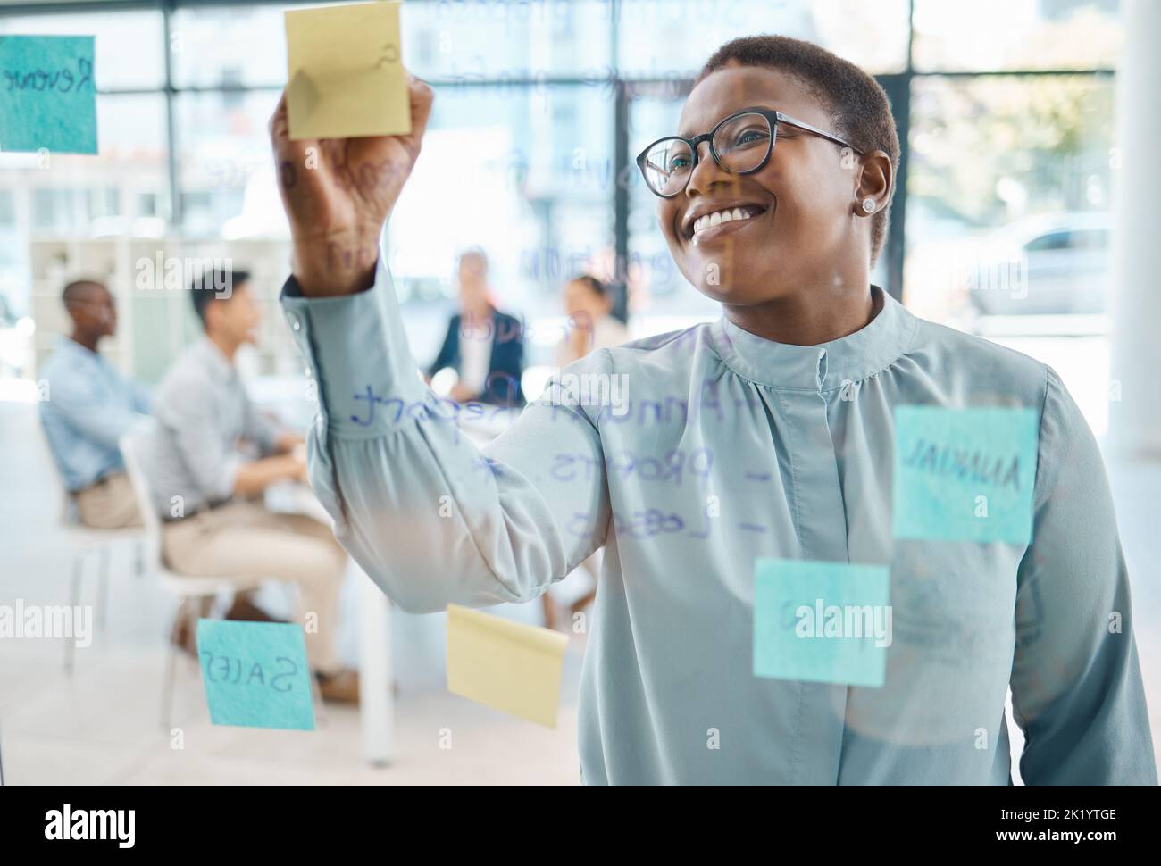 Planning, writing and sticky notes with business woman in strategy ...