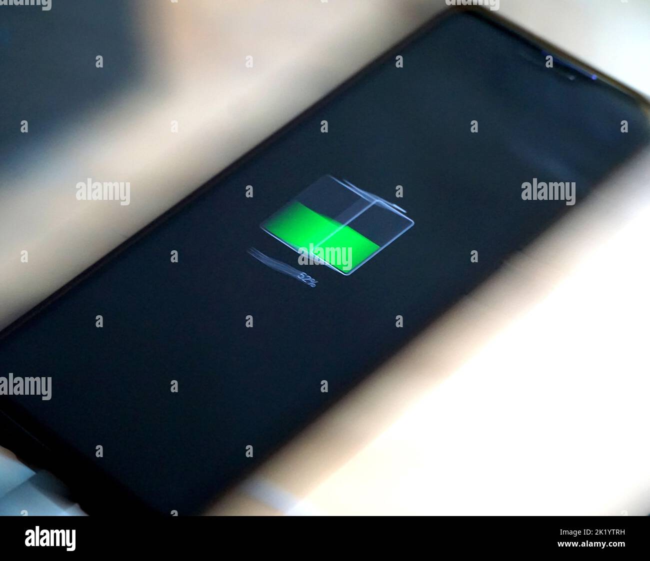 battery charge indicator , icon on a smartphone display Stock Photo - Alamy