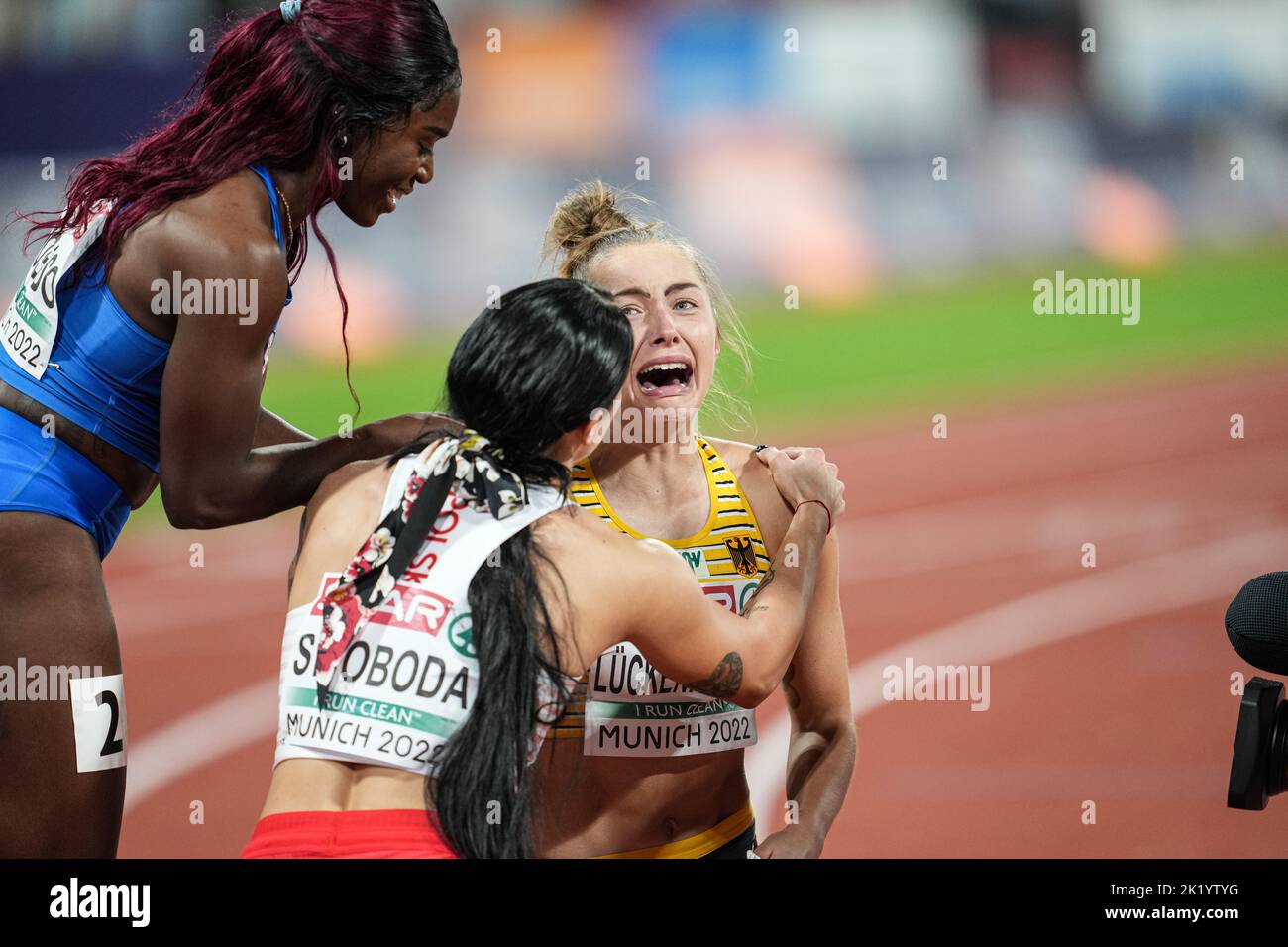 Gina Lückenkemper with her country's flag as the winner of the 100 ...