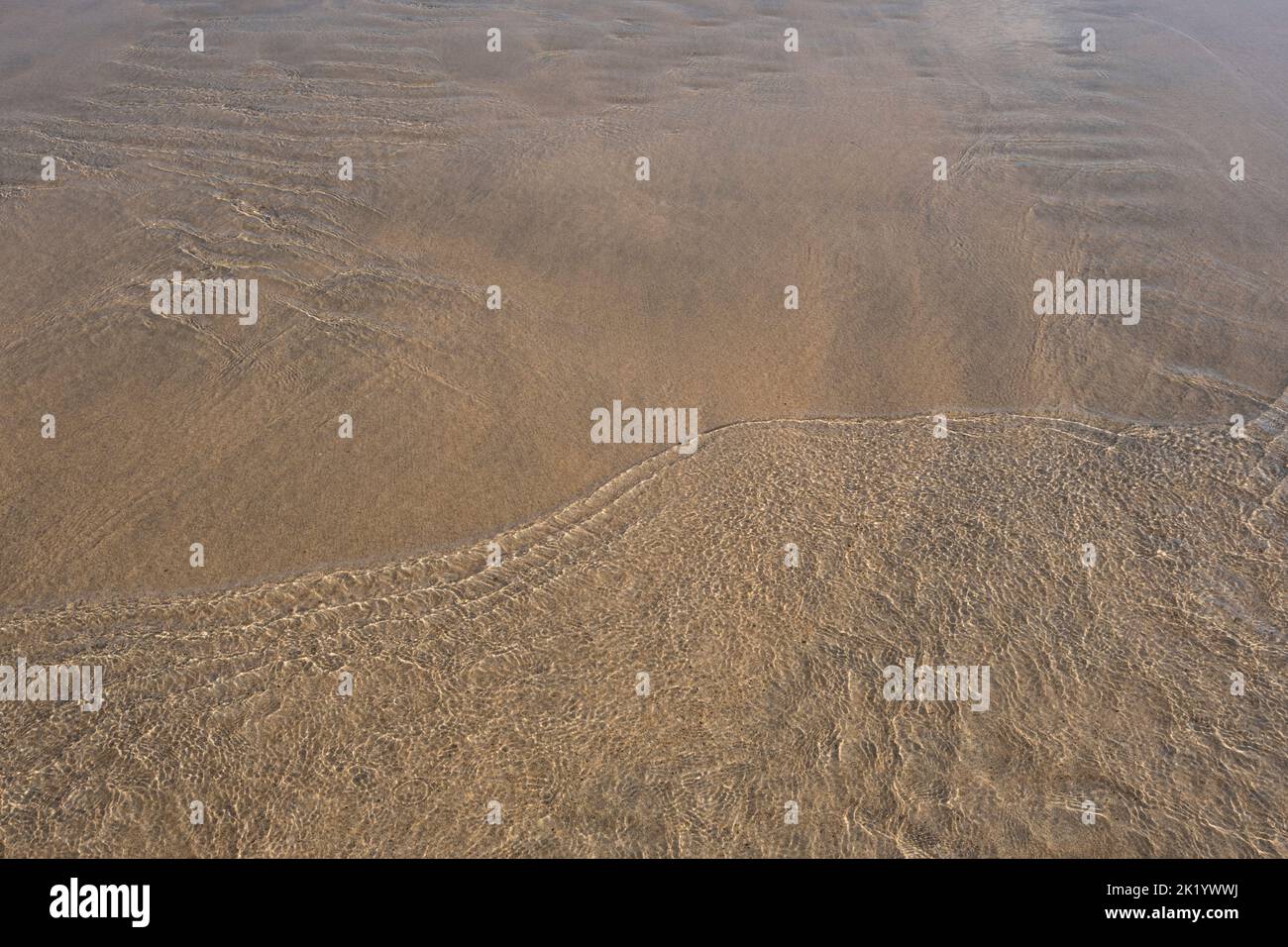 RIPPLES IN THE SAND PHOTOGRAPHED THROUGH THE SEA WATER Stock Photo - Alamy
