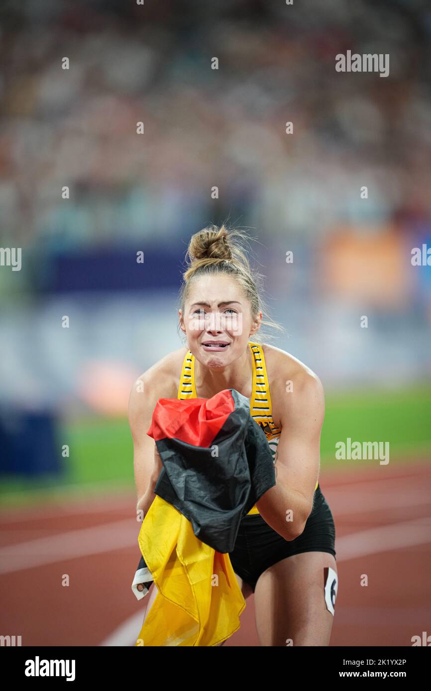 Gina Lückenkemper with her country's flag as the winner of the 100 ...
