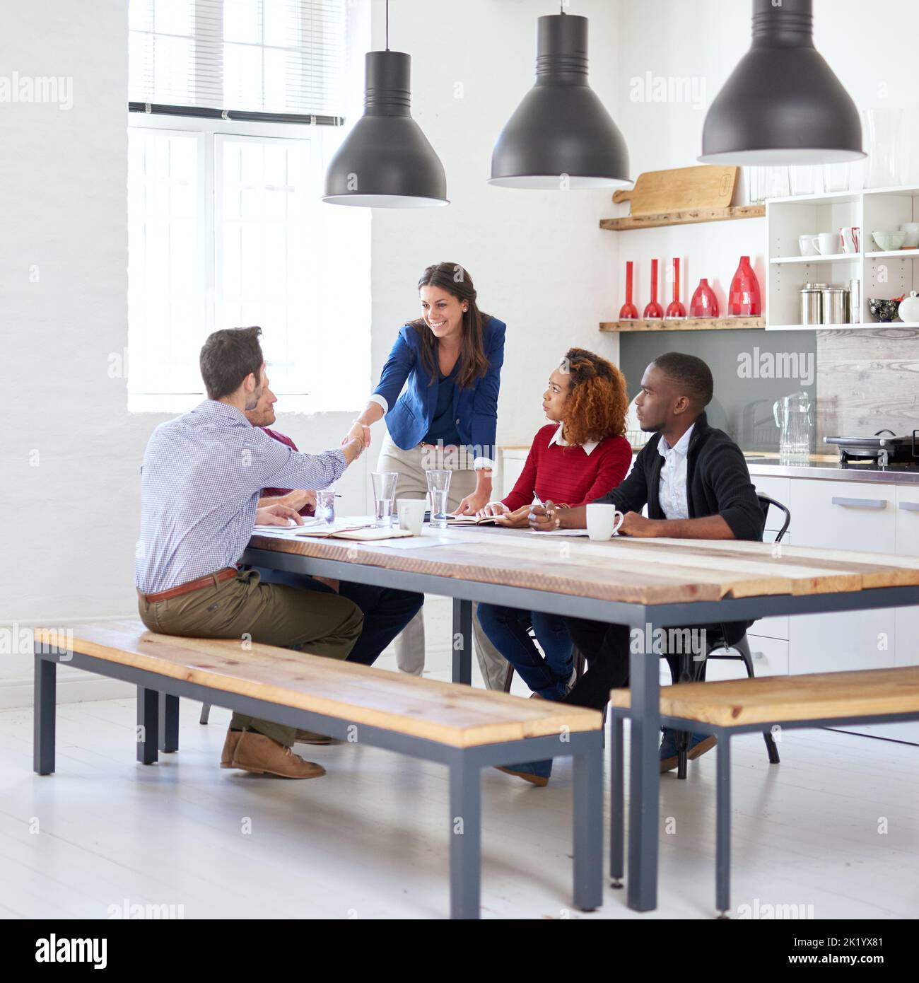 Welcome to the team. Full length shot of a young businesswoman shaking ...