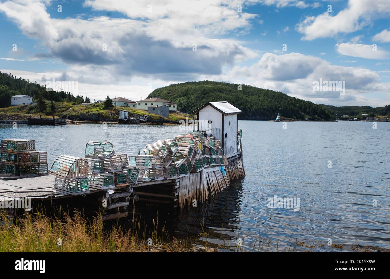 Wharf and lobster pots in rural Newfoundland community on the ocean ...