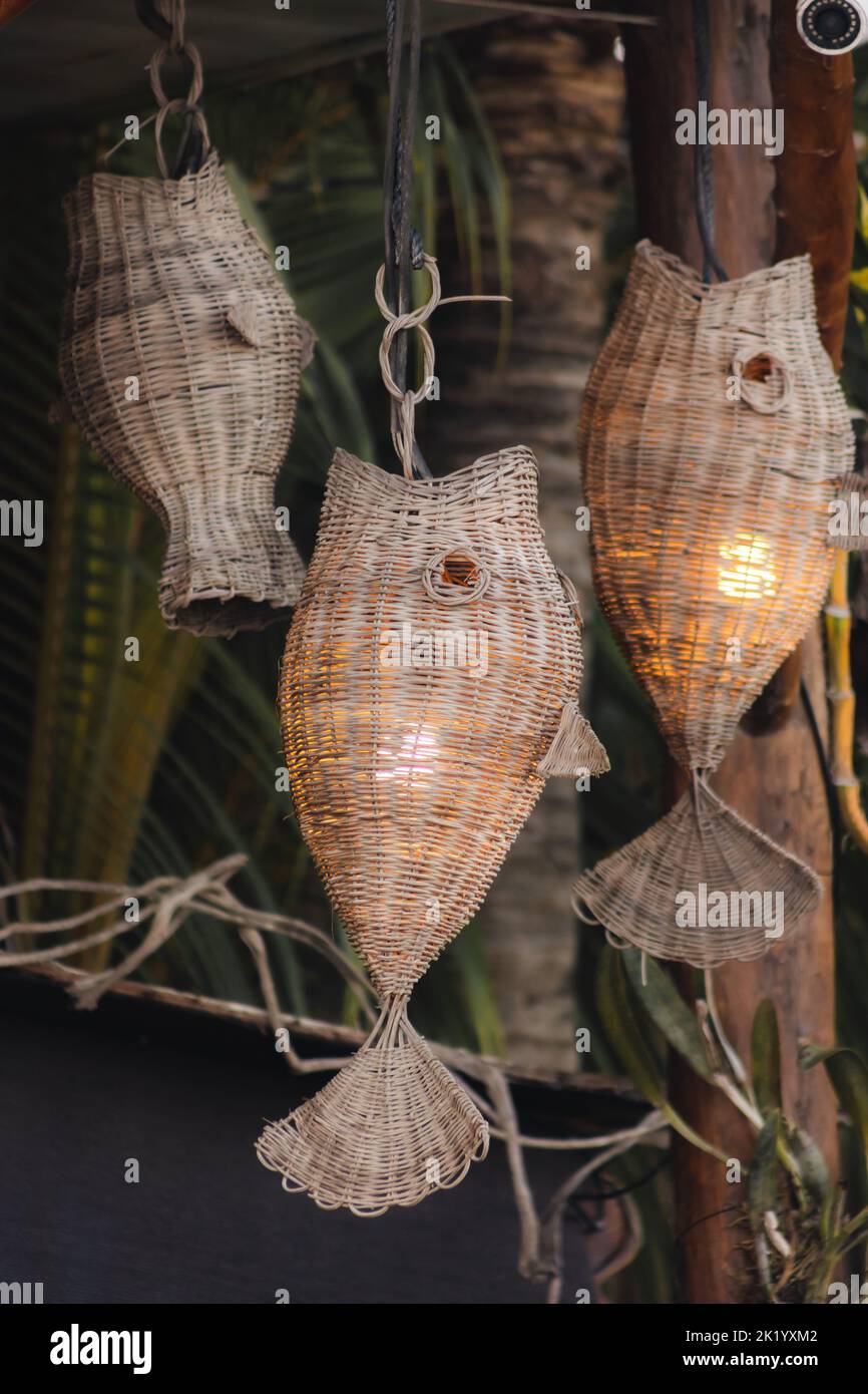 Fish shaped light fixture on an island hut Stock Photo - Alamy