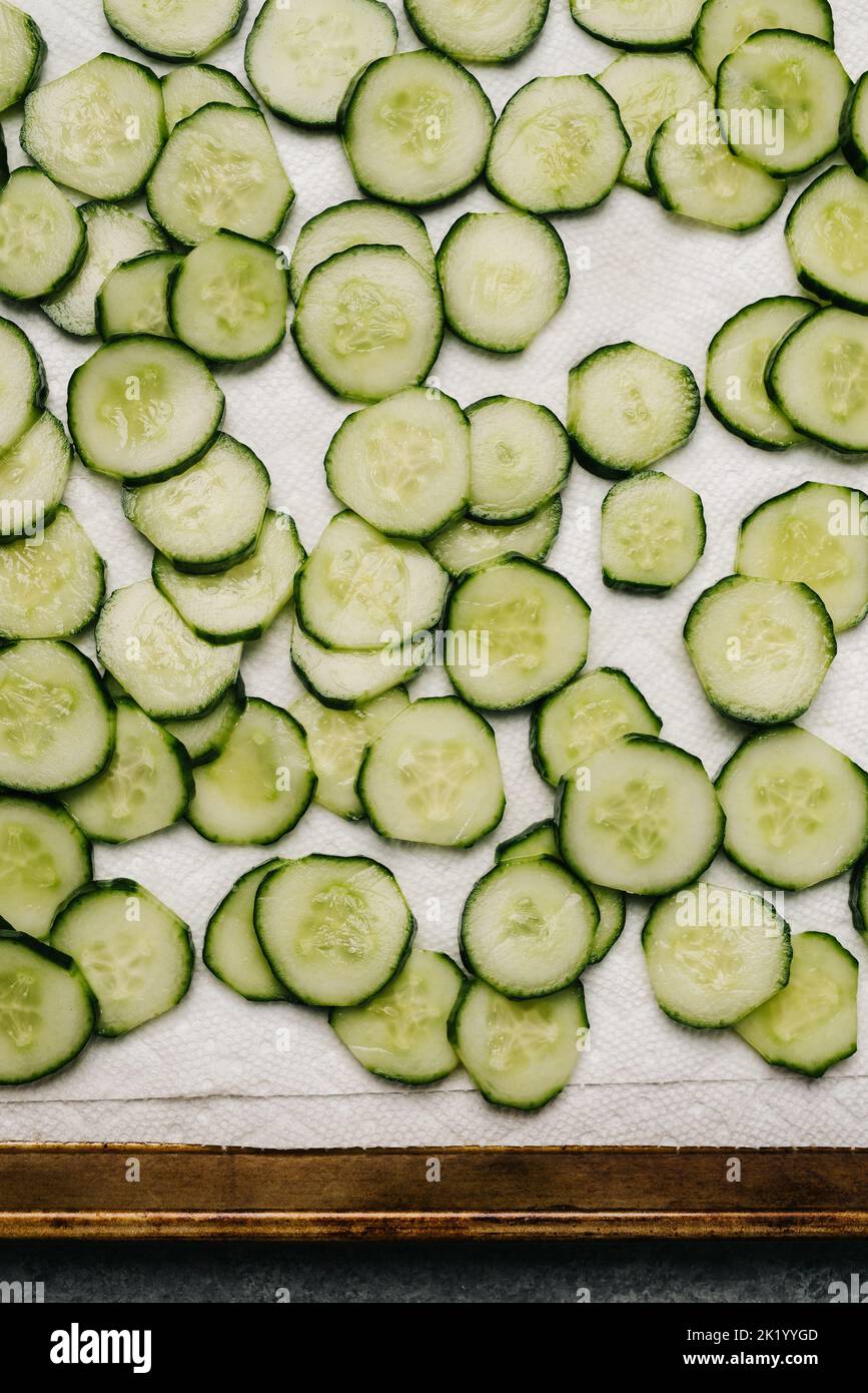 Sliced Cucumbers Drying on a paper towel Stock Photo - Alamy