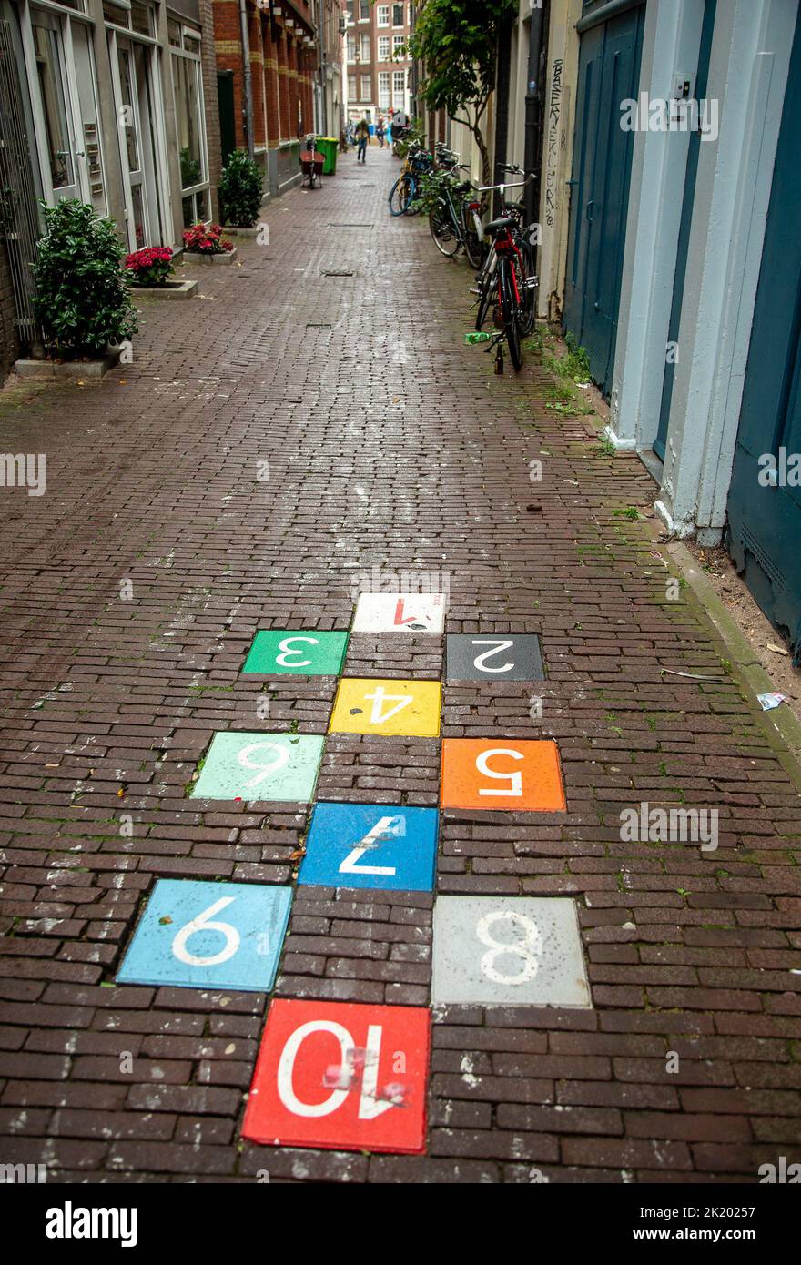 Numbers on a cobblestone street in Amsterdam Stock Photo - Alamy