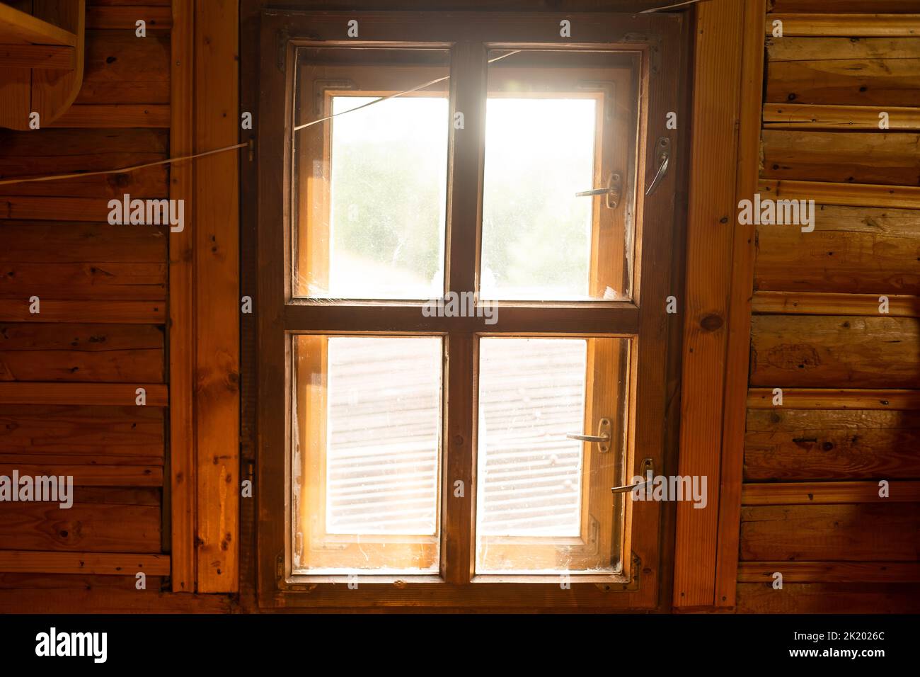 A wooden window in a wall made of logs with white background Stock ...