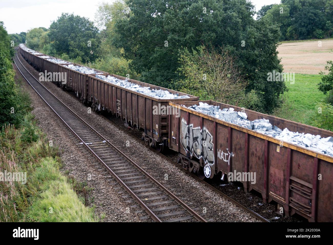 Train carrying trucks hi-res stock photography and images - Alamy