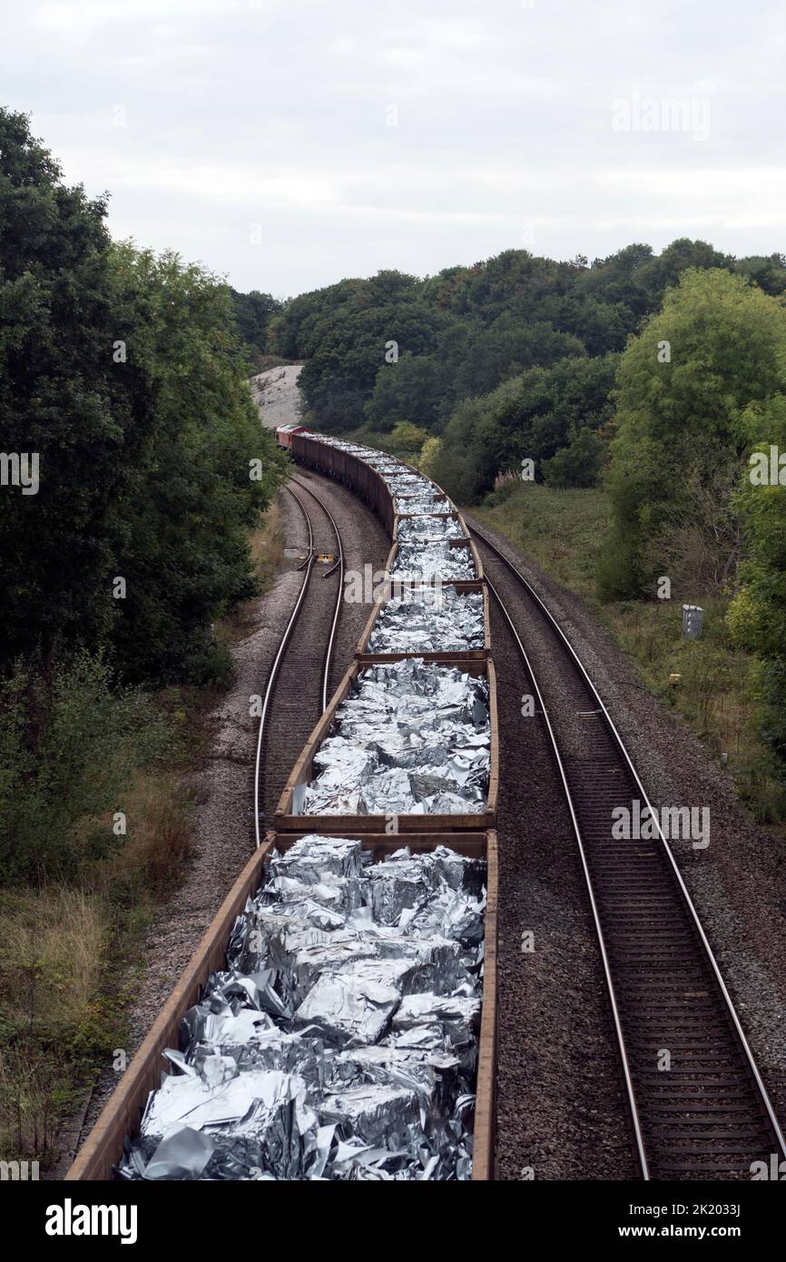 A train carrying scrap metal, Hatton Bank, Warwickshire, UK Stock Photo ...
