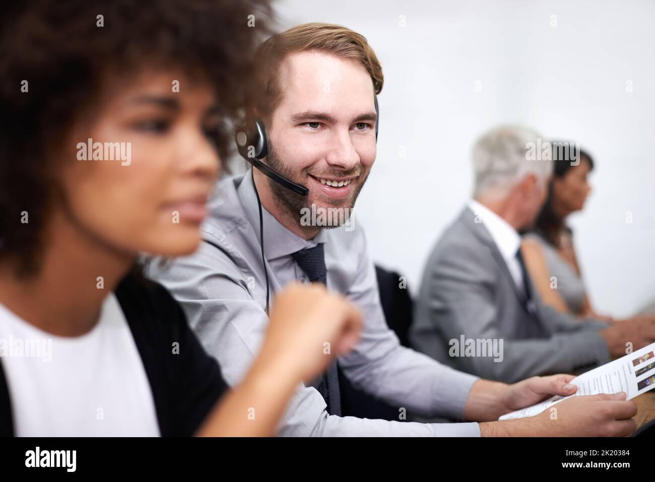 Just look at those sales figures. a happy young help desk operator ...