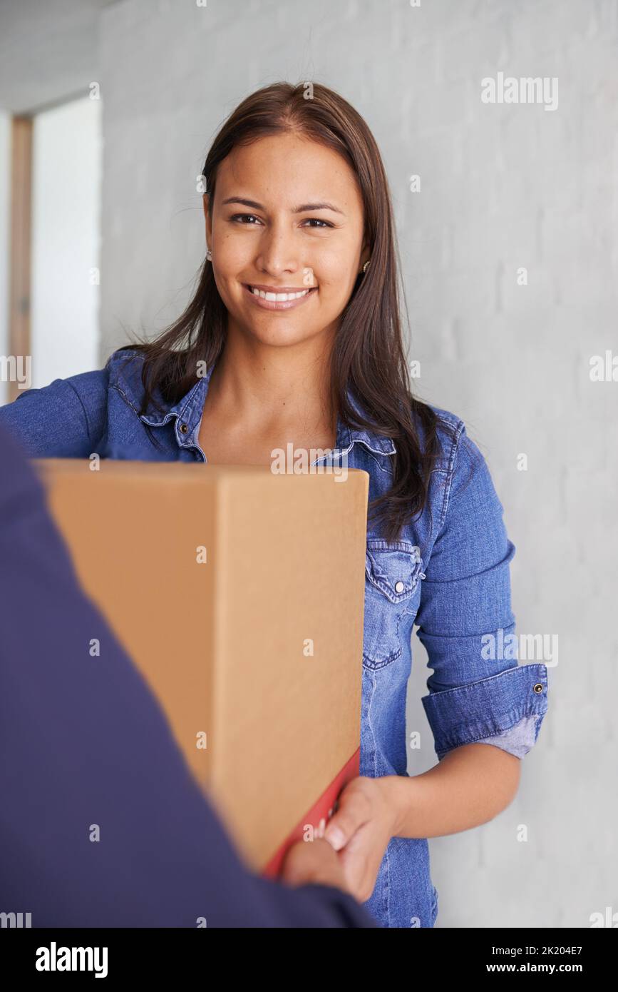 Receiving the last of the boxes...A beautiful young woman smiling at ...