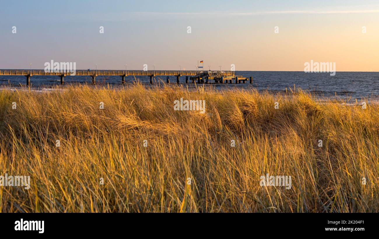 The rising sun illuminates the Bansin pier Stock Photo - Alamy
