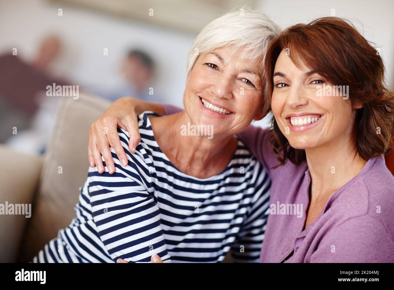 Portrait mother hugging daughter at home hi-res stock photography and images - Alamy