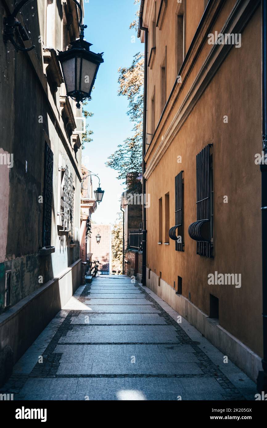 A narrow street between old buildings in Warsaw Stock Photo - Alamy