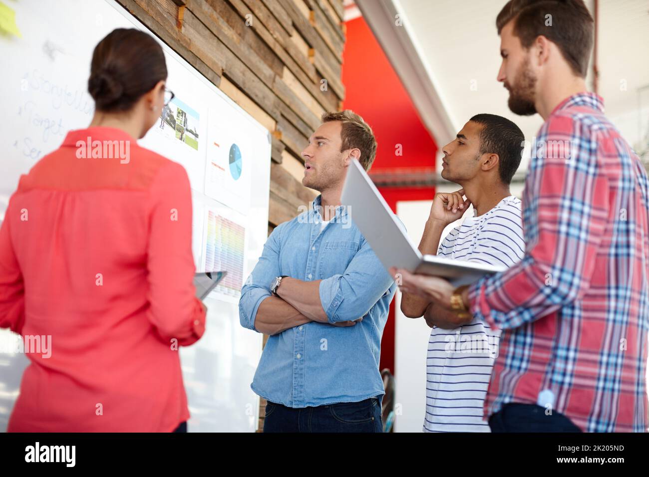 Time for a new perspective. a group of young designers brainstorming at ...