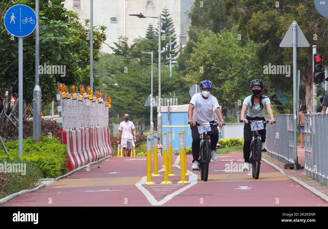 (L-R) Hong Kong cyclists Wong Kam-po and Vivian Ma Wing-yu cycling on ...