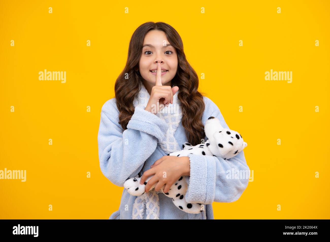 Funny teenage child hold toy. Child in pajamas, good morning. Happy ...