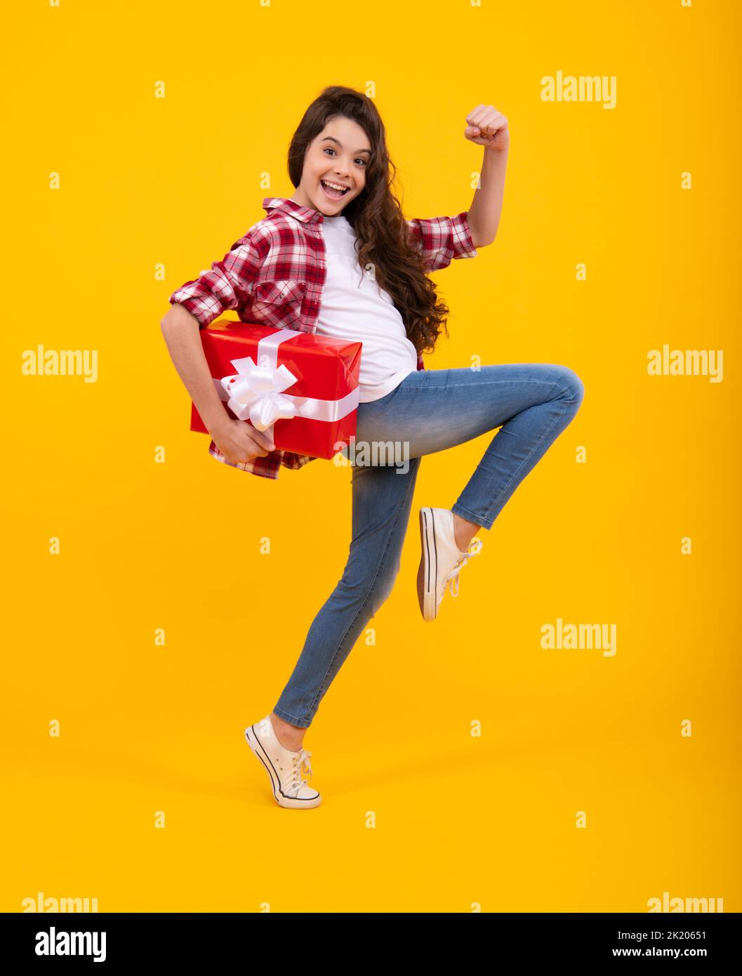 Amazed teenager. Teenager kid with present box. Teen girl giving ...