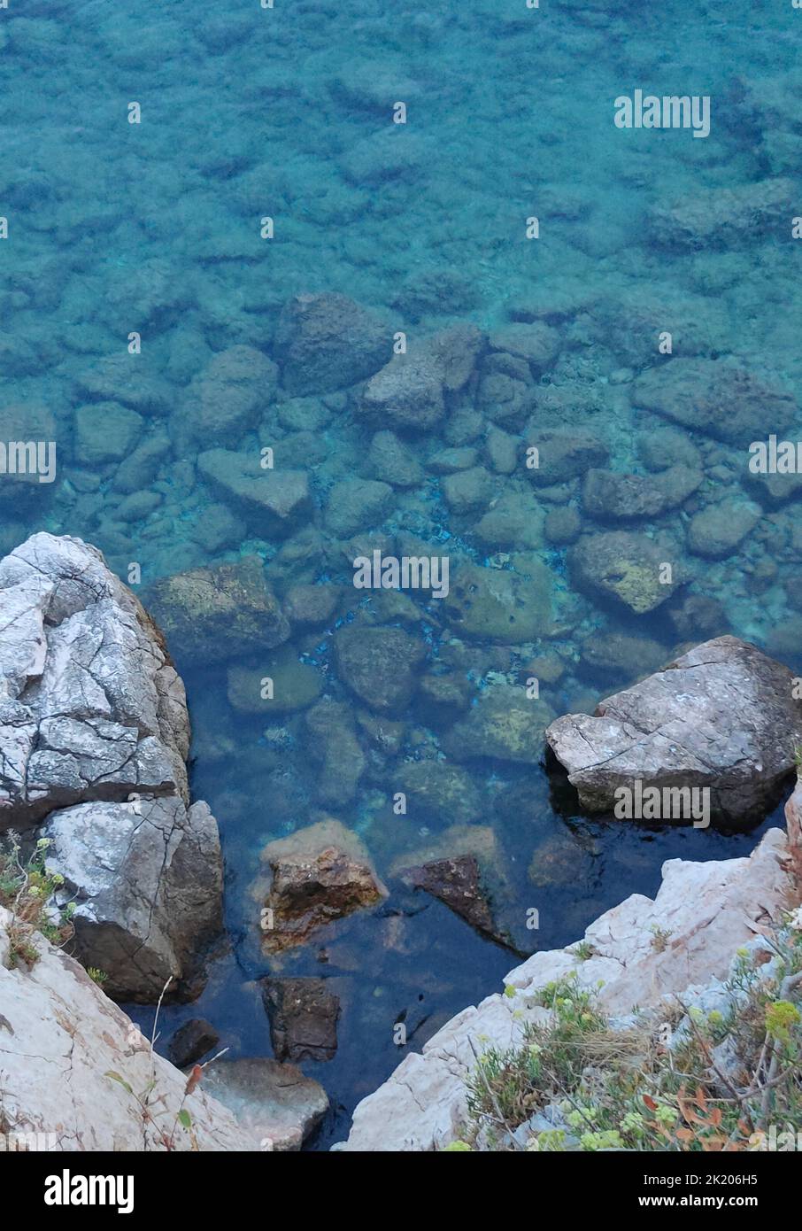 turquoise sea water with sunlight on turquoise pebbles background Stock ...