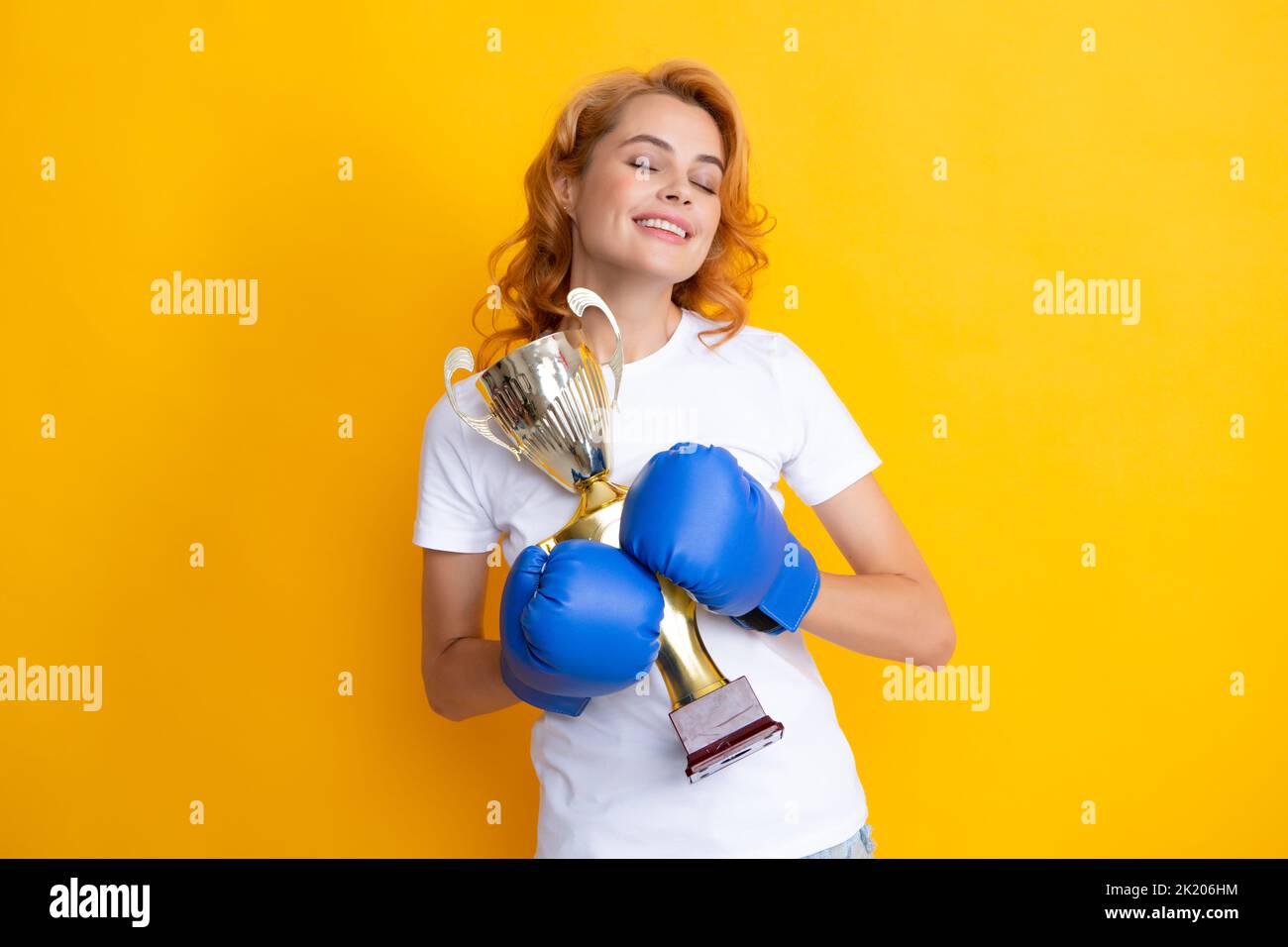 Winner female boxer Isolated on yellow background. Winning success ...