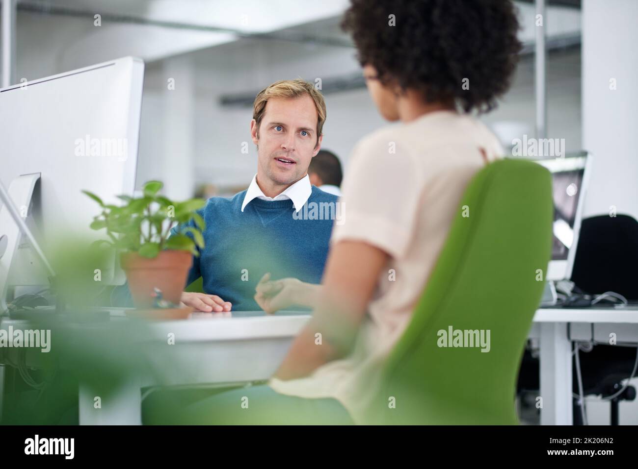 Bouncing creative ideas off each other. two colleagues having a ...