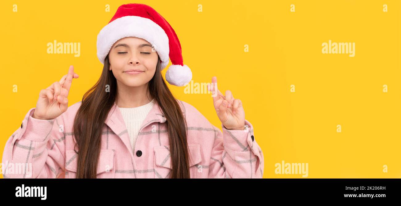 Winter child isolated portrait. dreamy kid in santa claus hat crossed ...