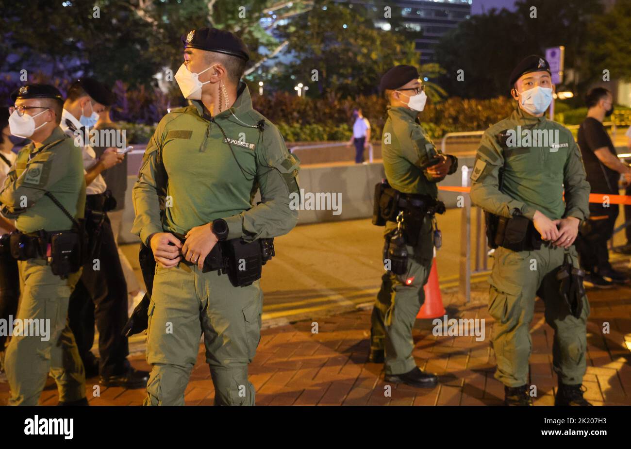 Police officers stand guard outside the British Consulate-General in ...