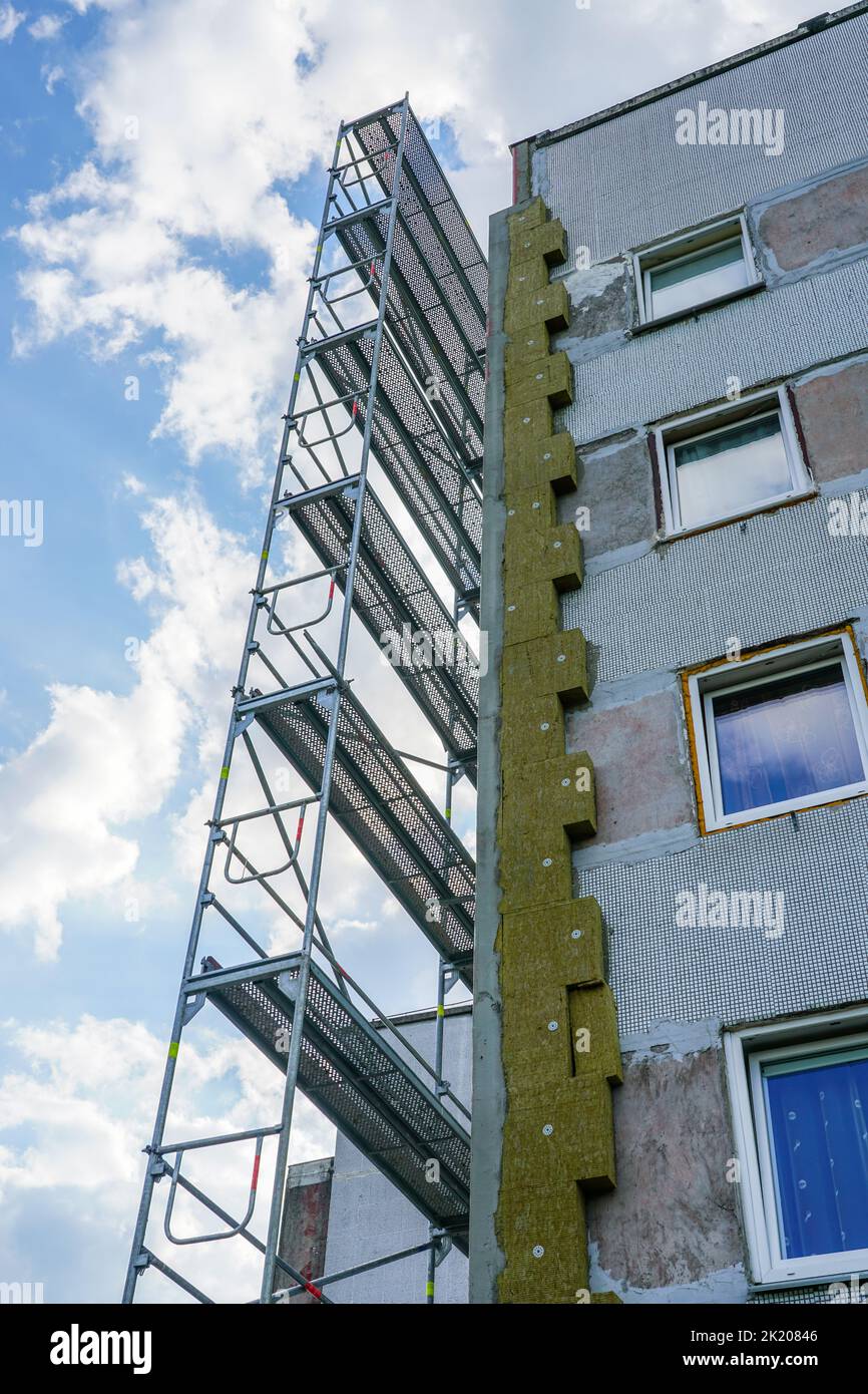 Thermal insulation of the facade of an apartment building with thick ...