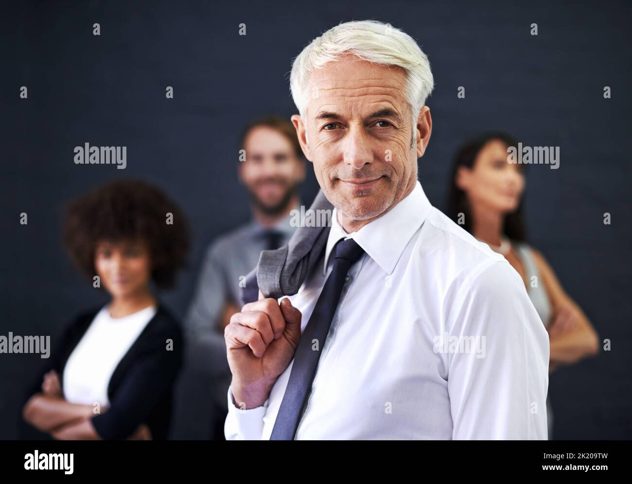 Taking my team to the top. a mature professional man standing in front ...