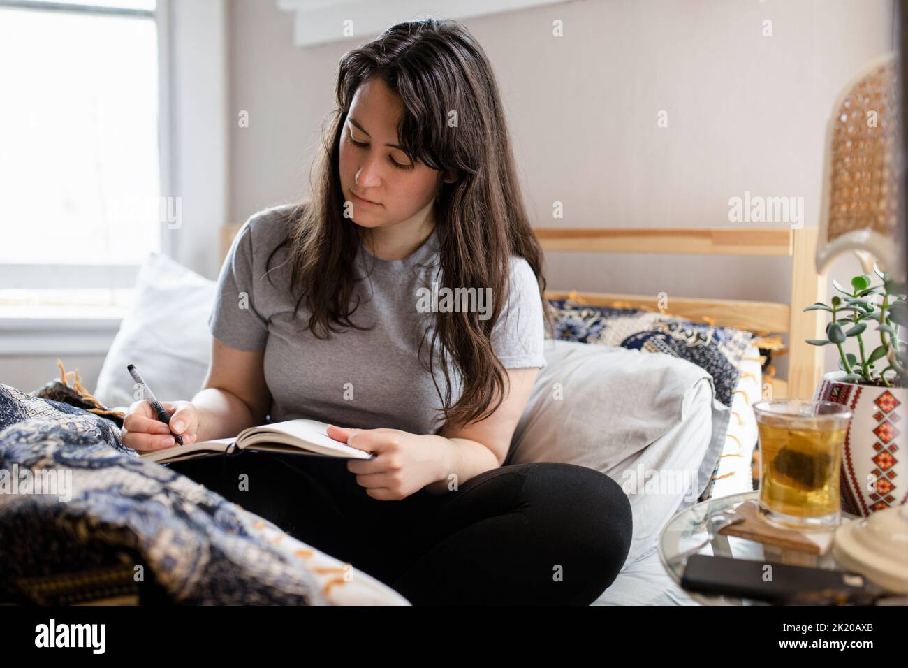 Woman and diary and bed hi-res stock photography and images - Alamy
