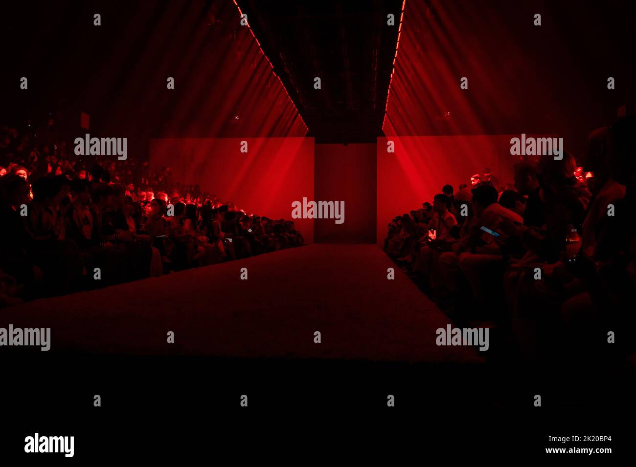 A show of red lights marks the beginning of the runway show. ISSUE ...