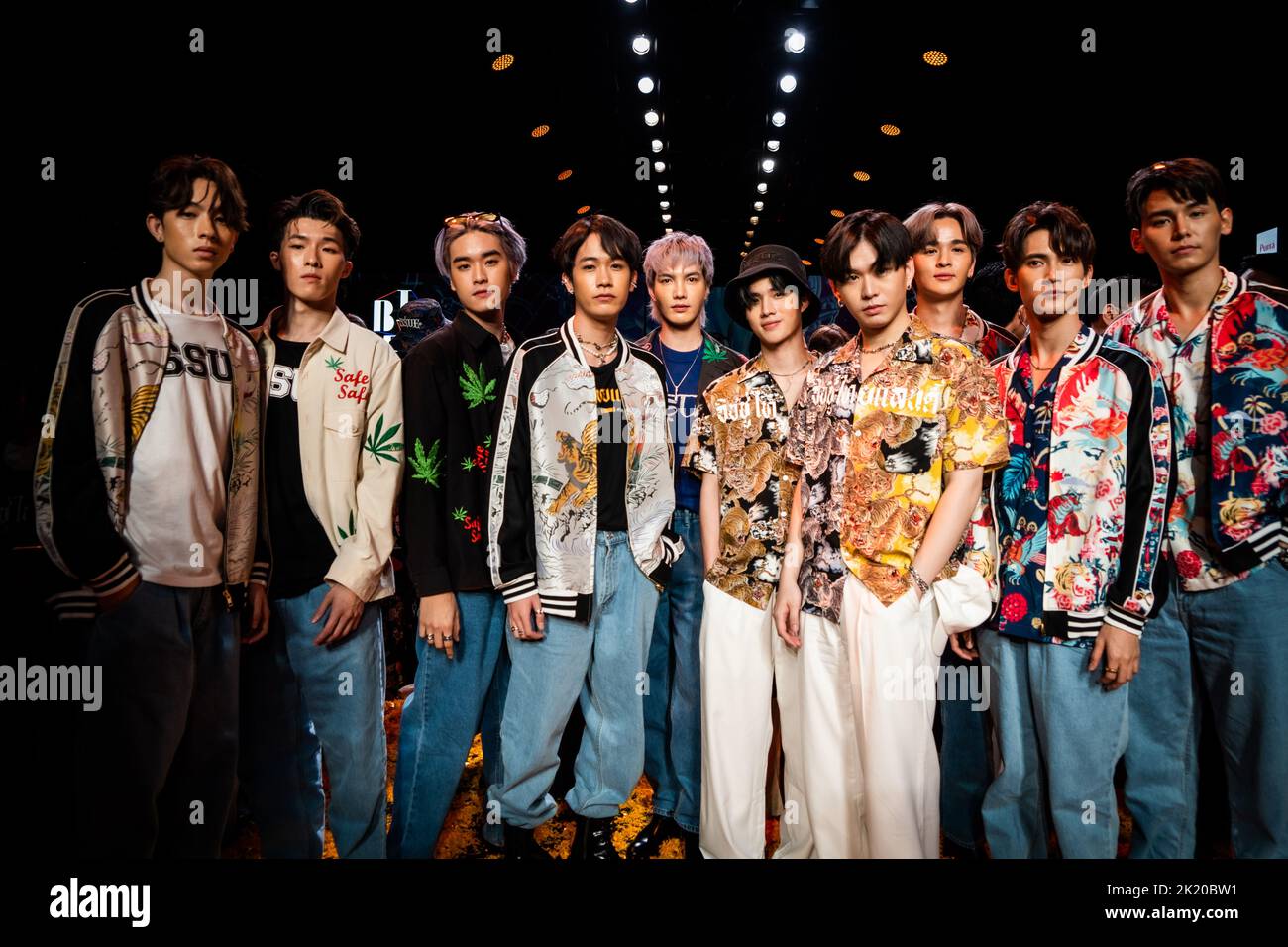Thai models pose for a group photo at the end of their runway show ...