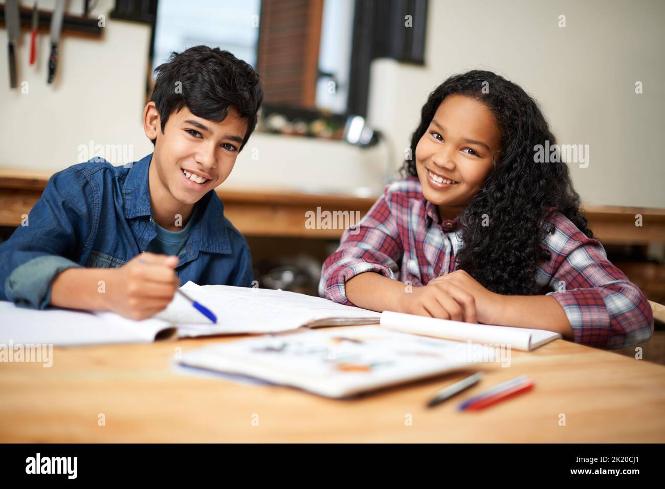Study buddies make homework easier. two young students studying ...