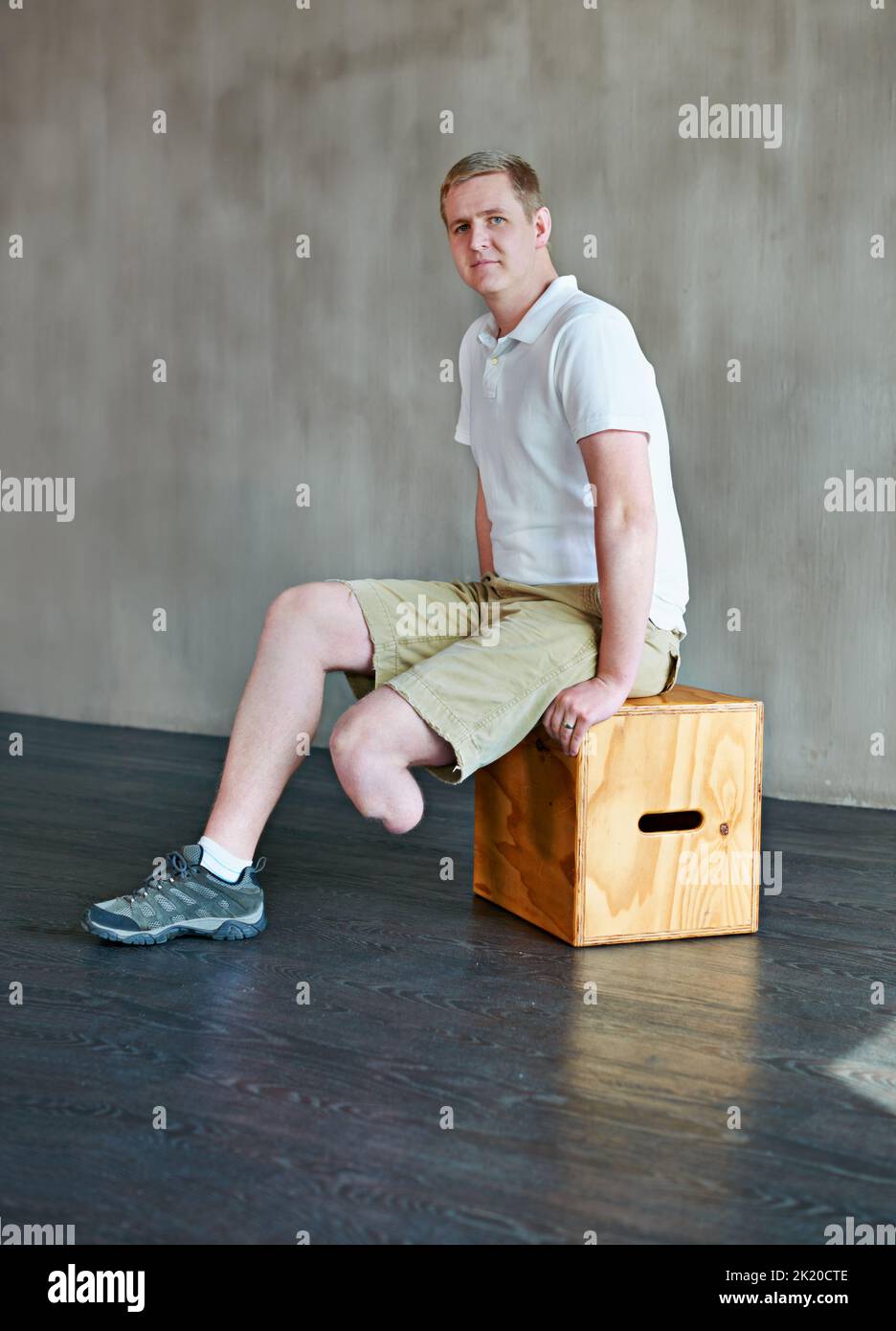 Im more than my disability. a young amputee sitting in a gym Stock ...