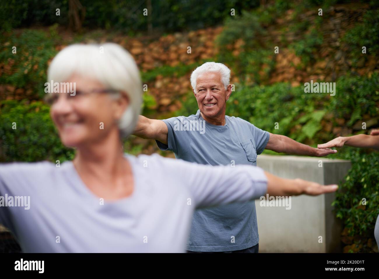 Maintaining my balanced life. a senior man enjoying an outdoor yoga ...